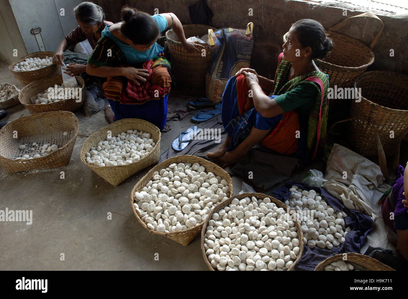 Bangladeshi tribal women sell traditional local food in Bandarban ...