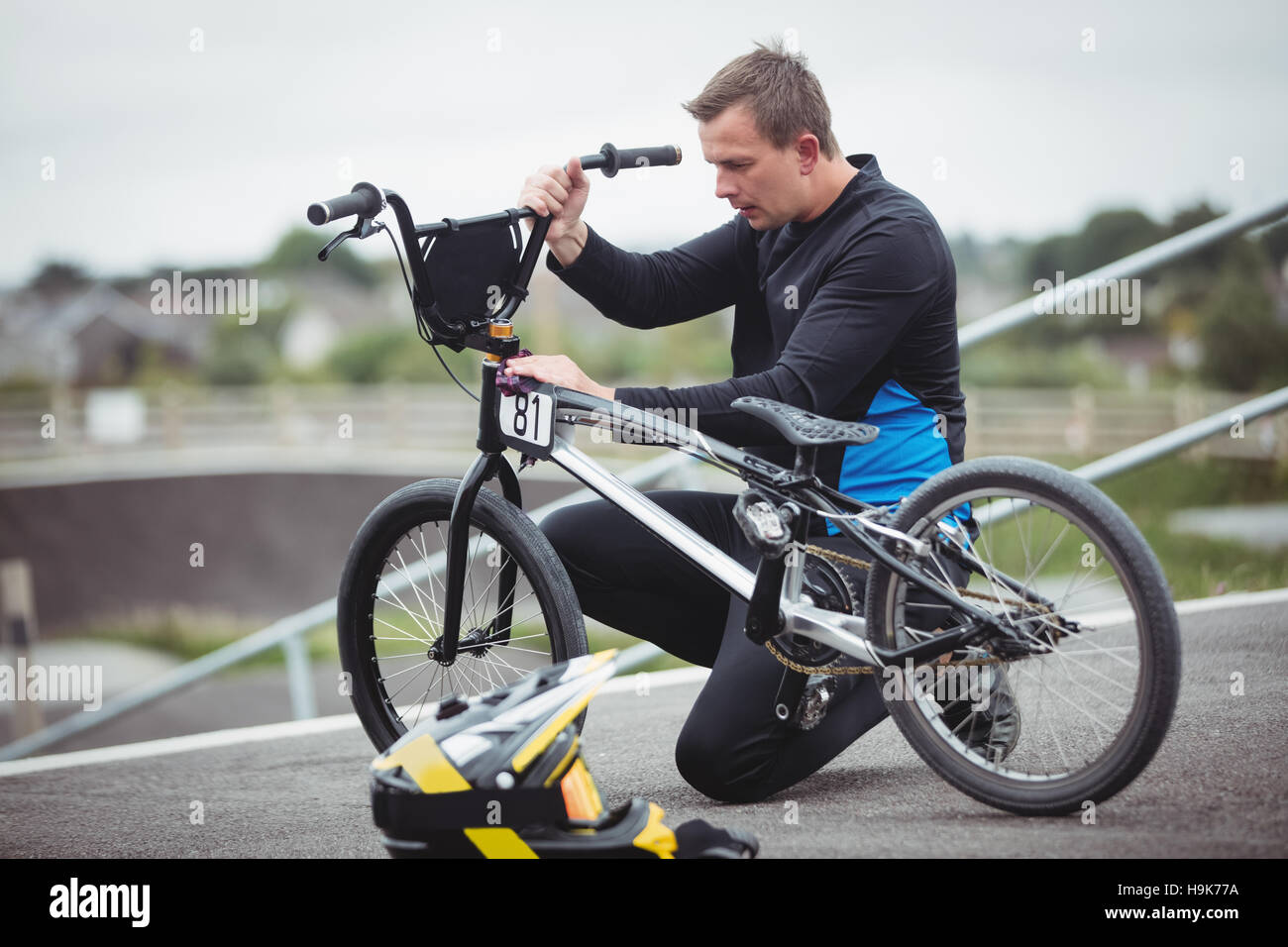Cyclist repairing a BMX bike Stock Photo - Alamy