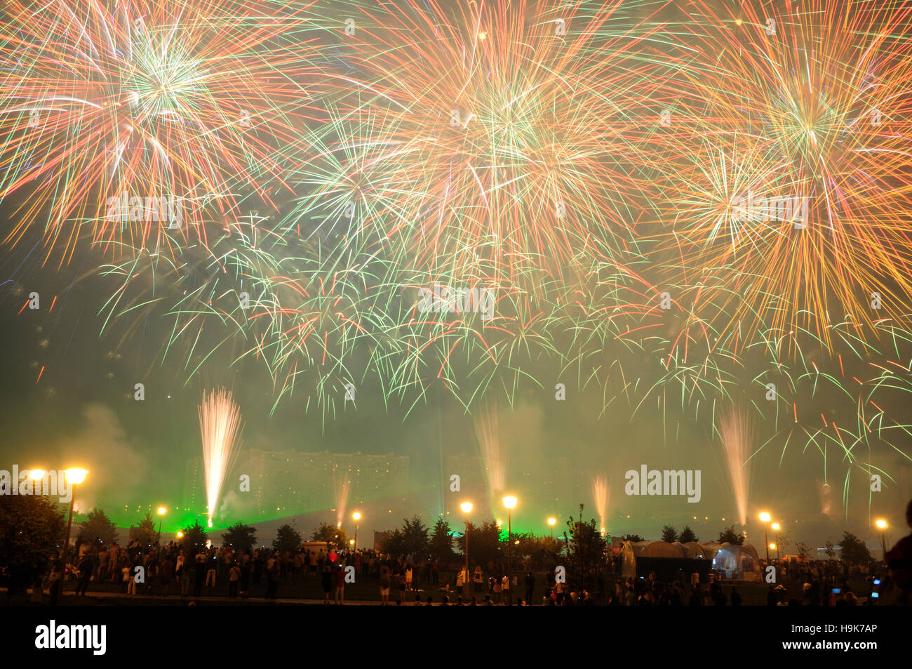 Firework and spectators Stock Photo - Alamy