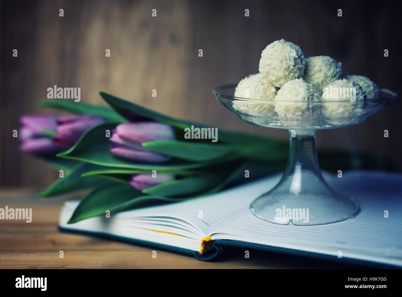reading book with tea flower and sweet Stock Photo - Alamy