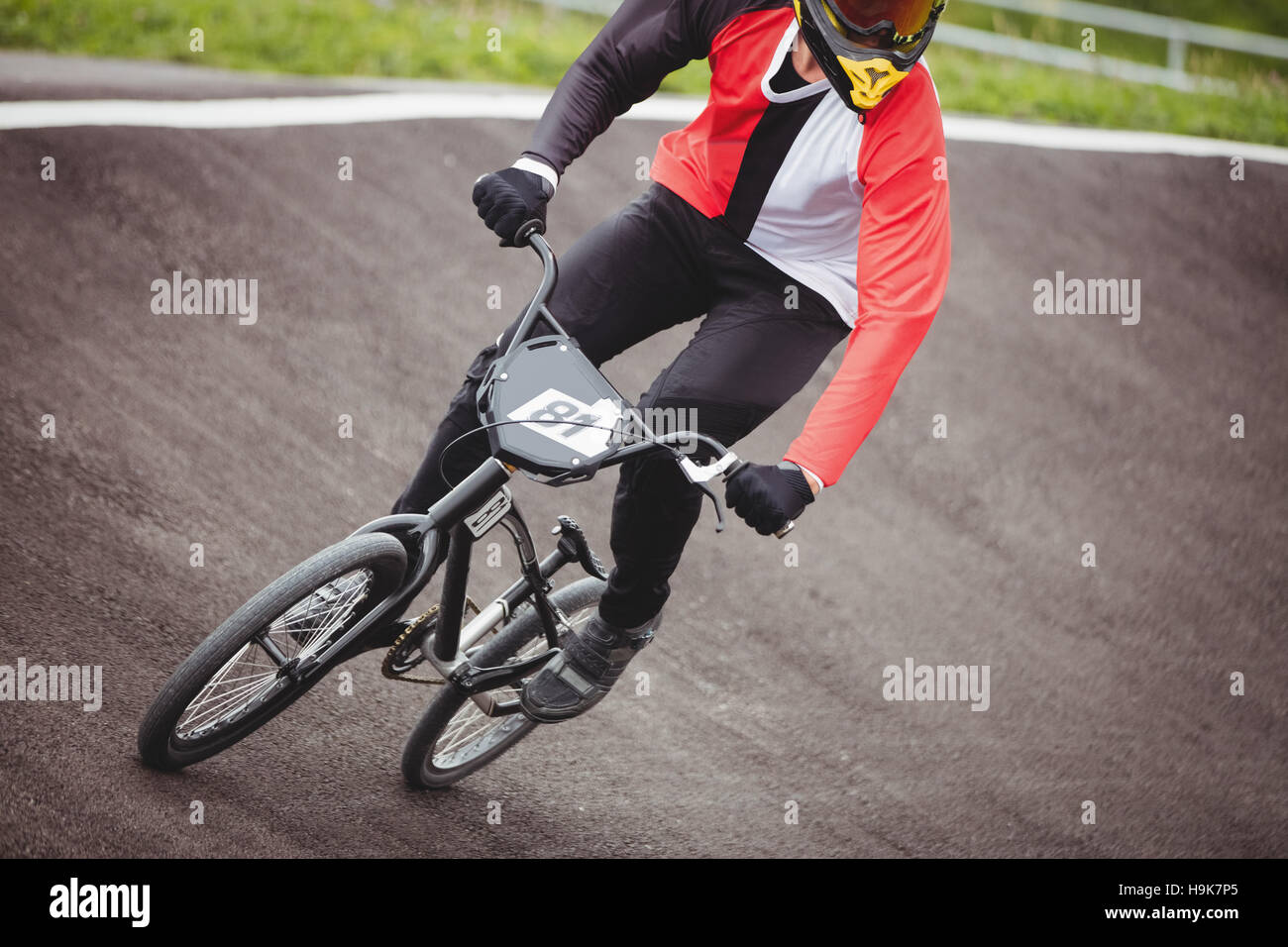 Cyclist riding BMX bike Stock Photo - Alamy