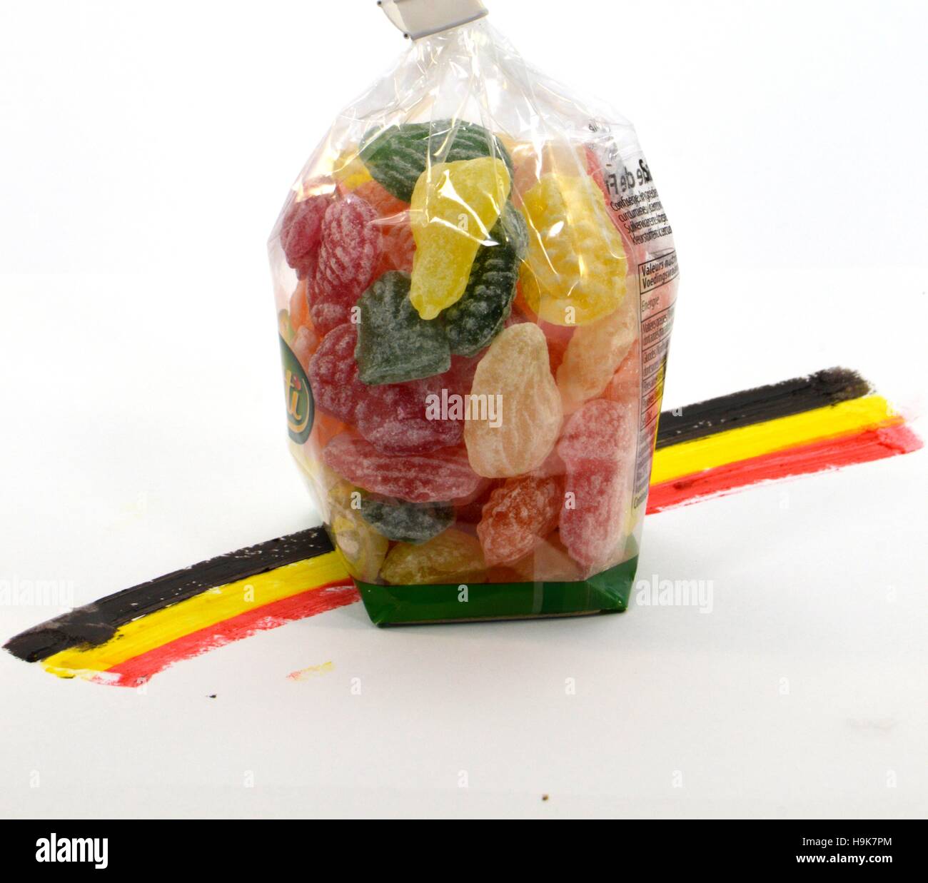 Belgian candy of several colors on and Belgian flags in white ...