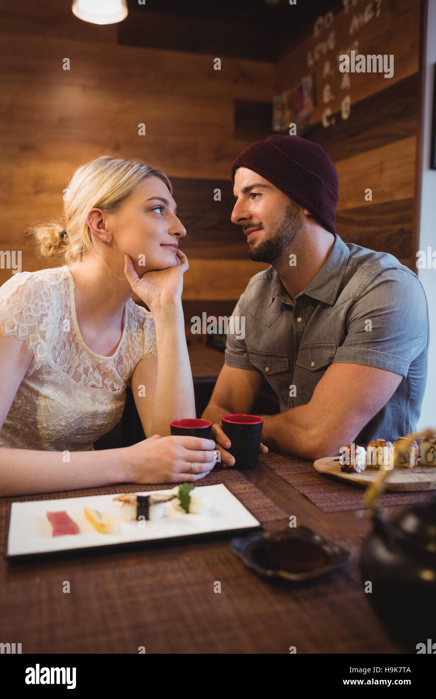 Couple having sake drink in restaurant Stock Photo - Alamy