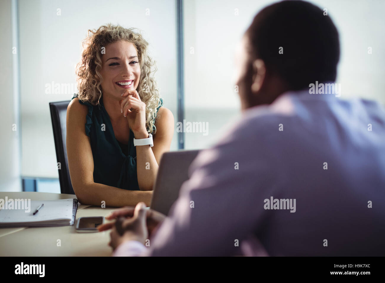 Happy male executives interacting other hi-res stock photography and images - Alamy
