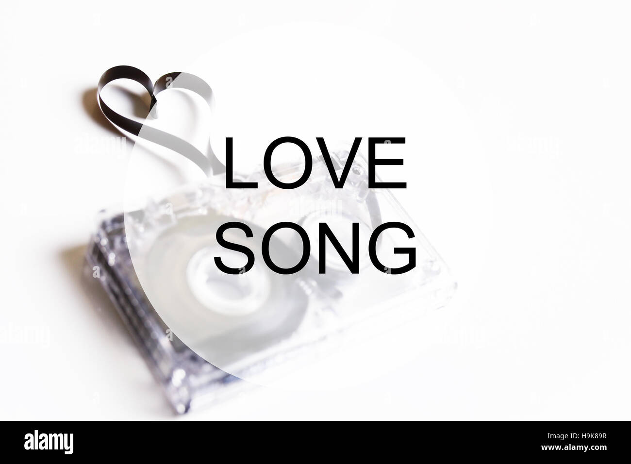 love song background om audio cassette tape shape heart Stock Photo - Alamy