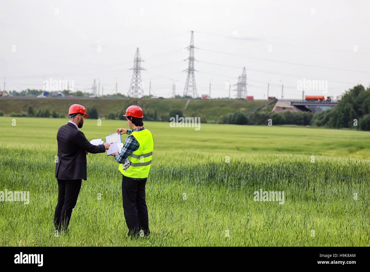 construction two man in the field Stock Photo - Alamy
