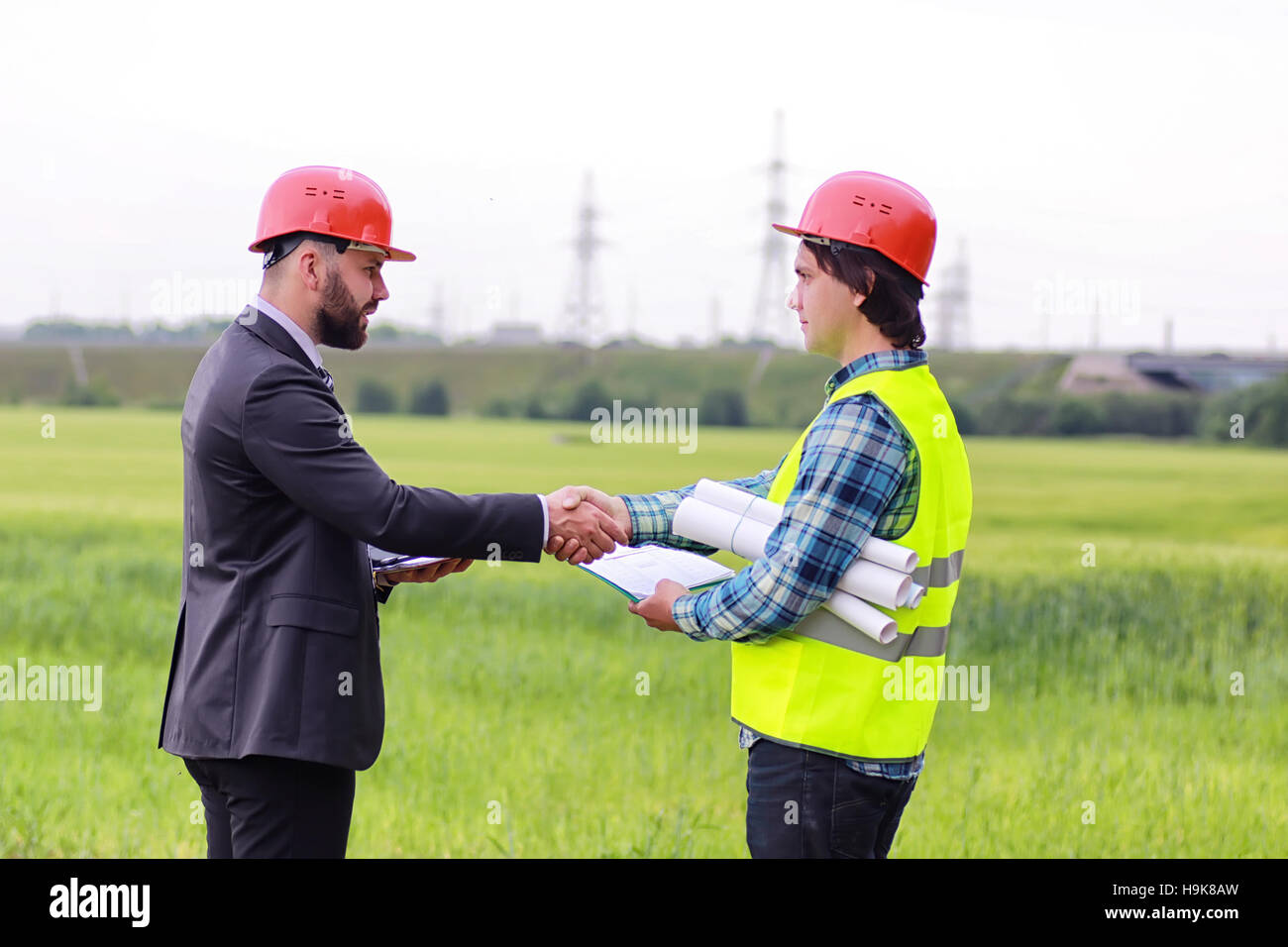 construction two man in the field Stock Photo - Alamy