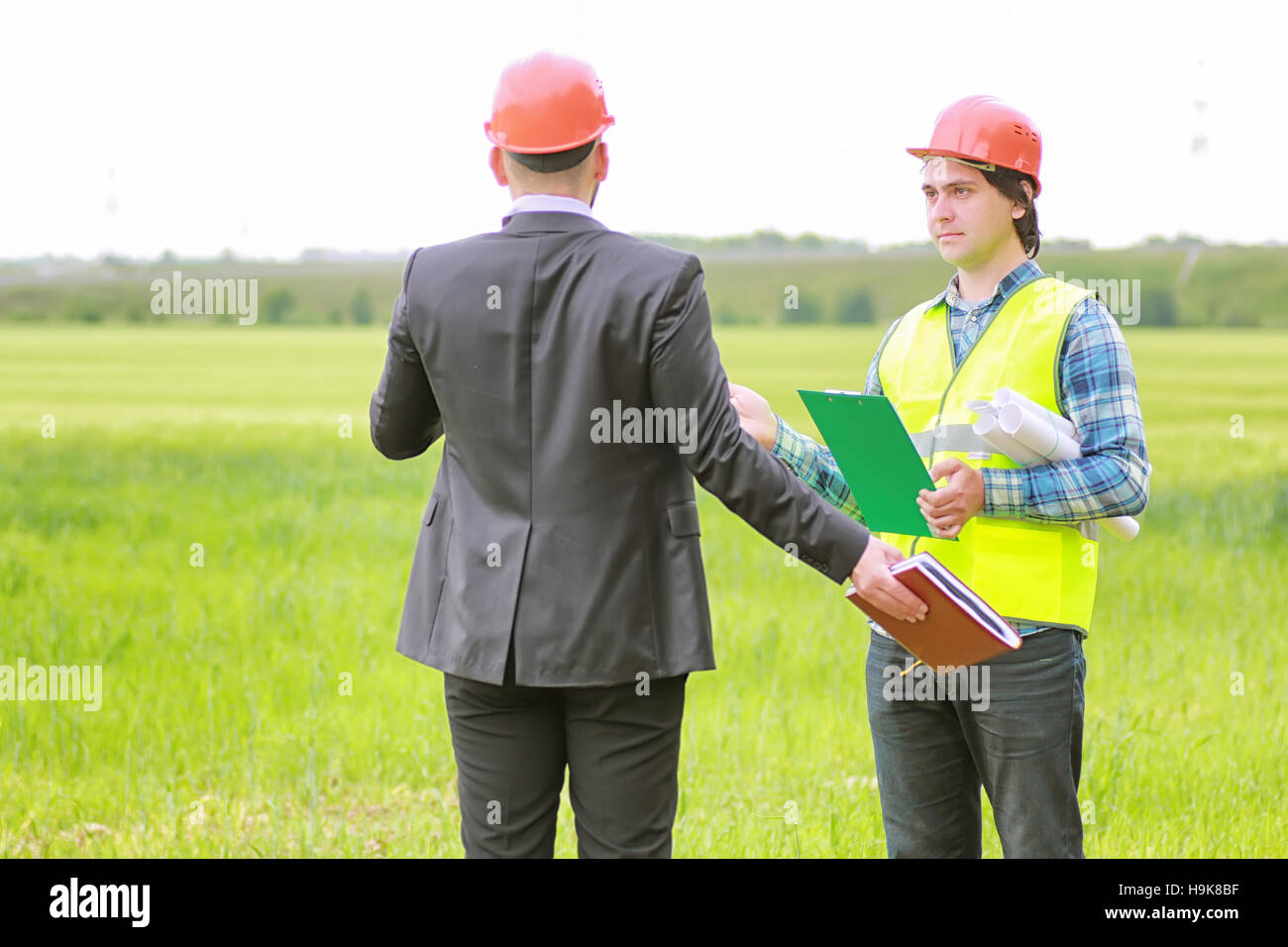 construction two man in the field Stock Photo - Alamy