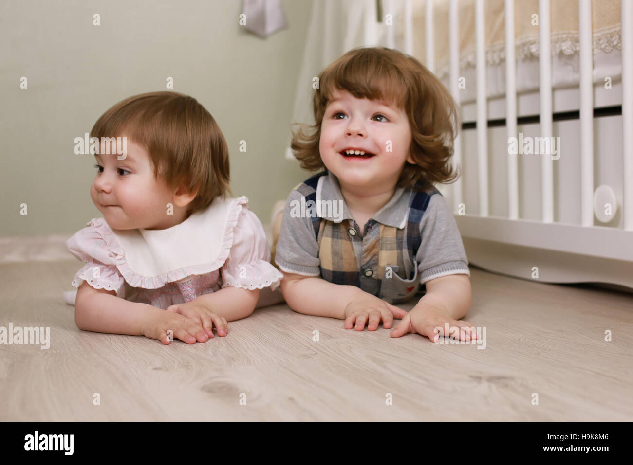 little kid sit in cot Stock Photo - Alamy