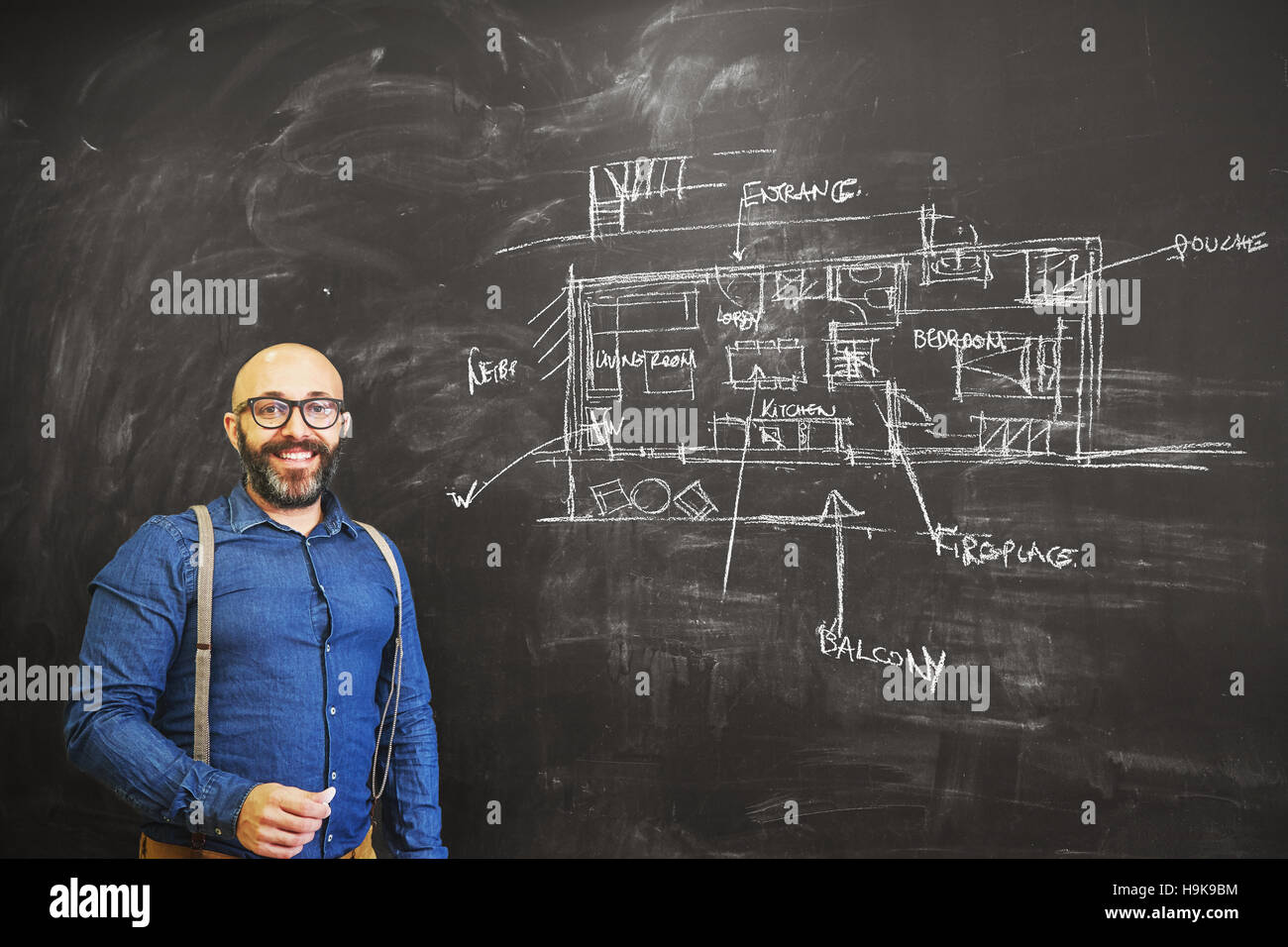 Architect man sketching new project on chalkboard Stock Photo - Alamy