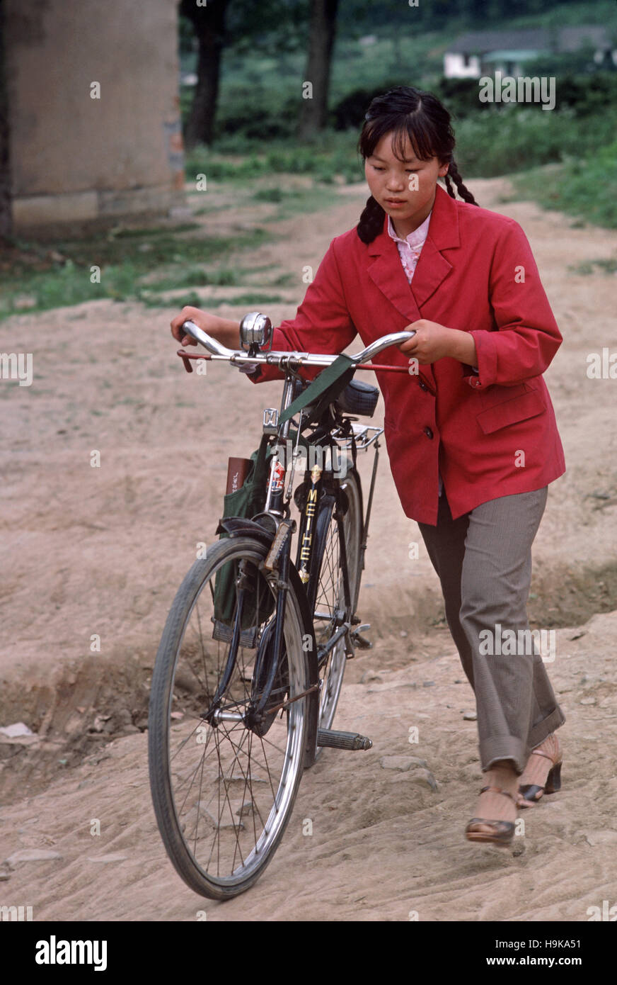 Girl with bicycle, Hangzhou, Zhejiang Province, China Stock Photo - Alamy