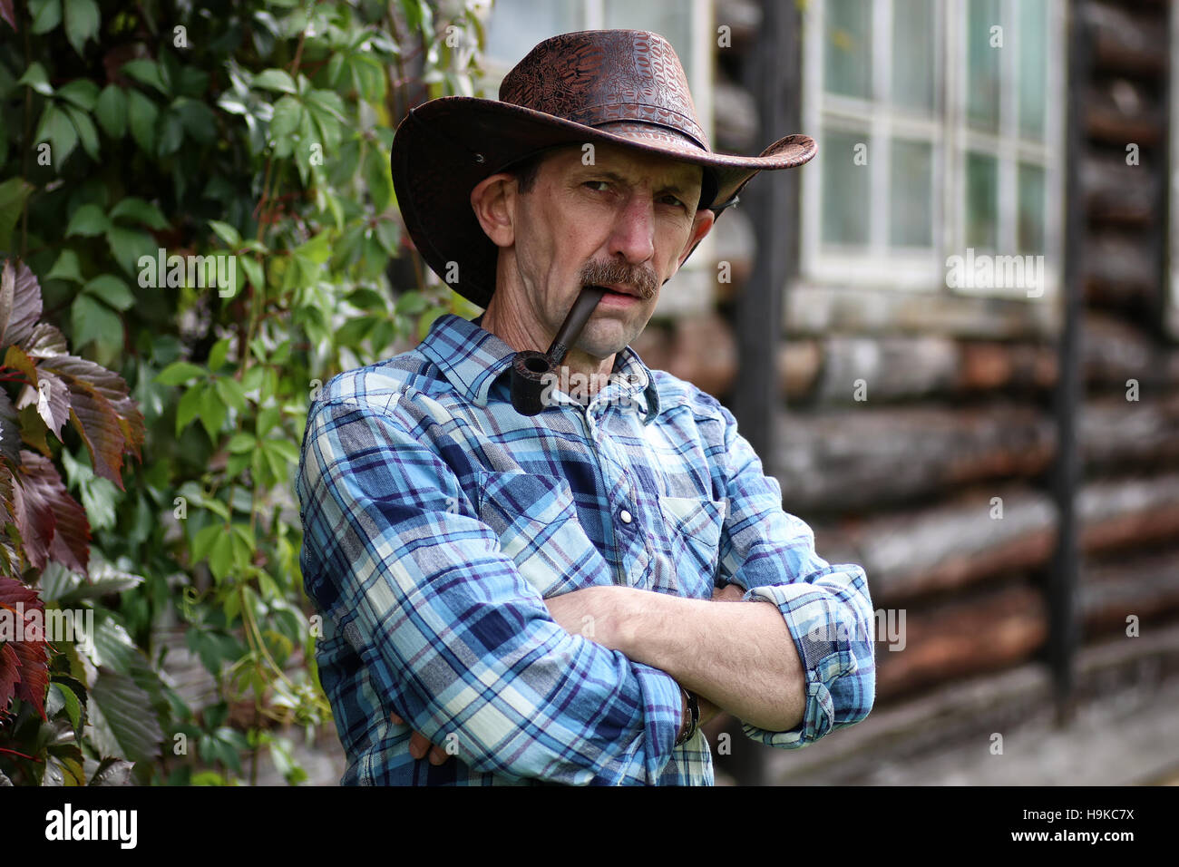 cowboy man smoke pipe Stock Photo - Alamy