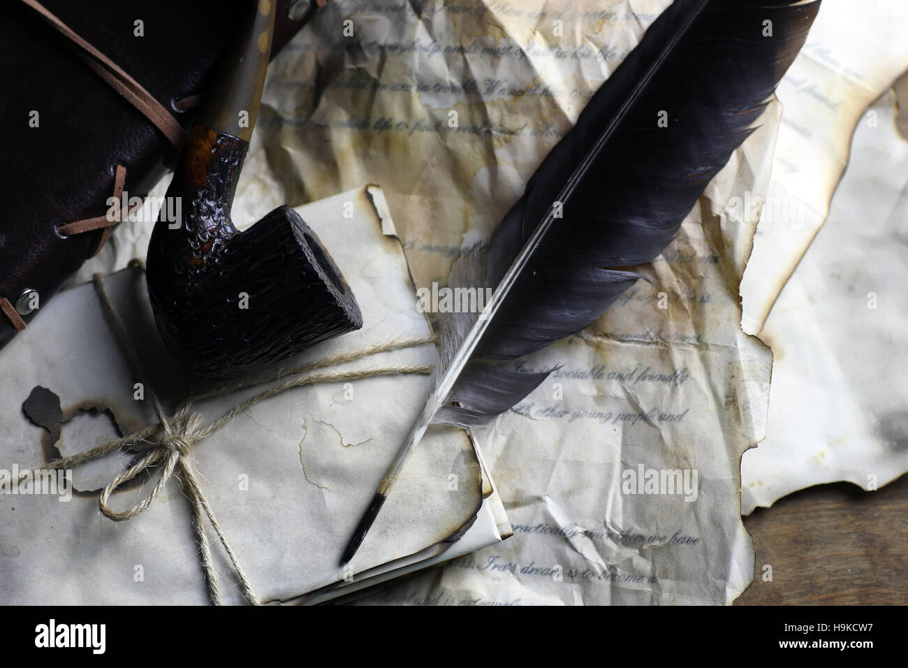 old paper letter feather Stock Photo - Alamy