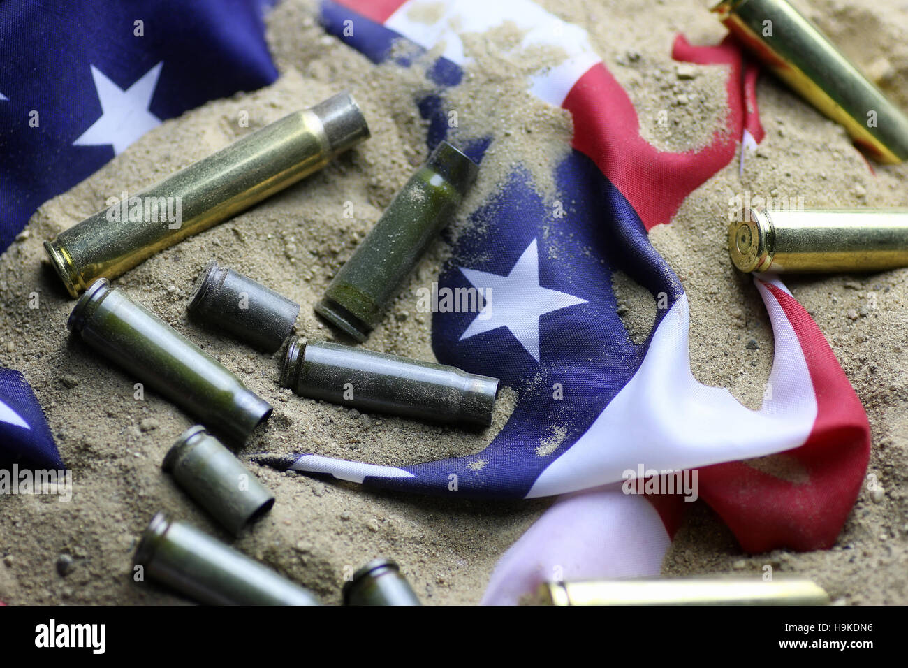 bullet and usa flag in the sand war Stock Photo - Alamy