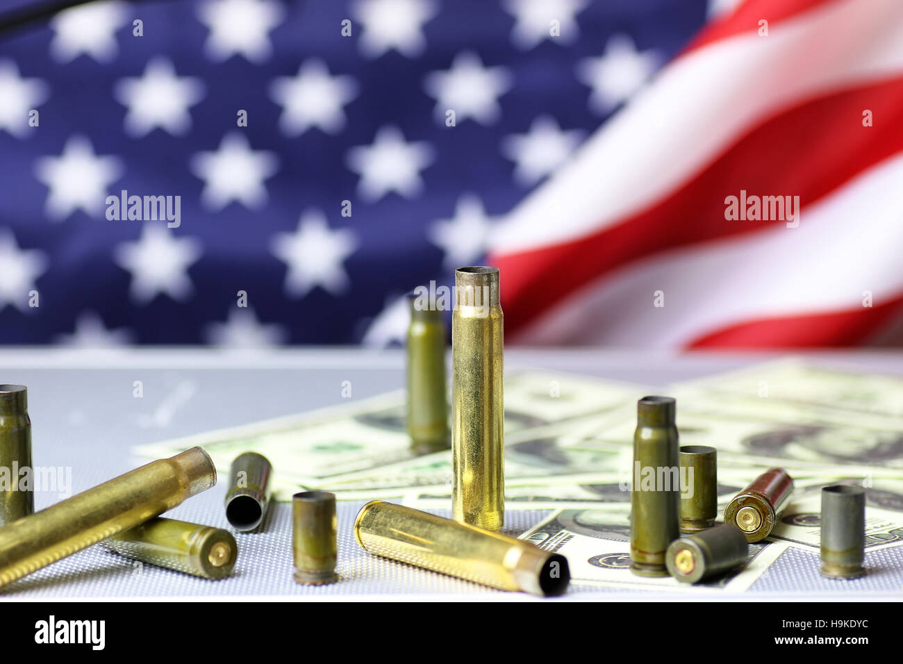 bullet and money dollar on the silver case Stock Photo - Alamy