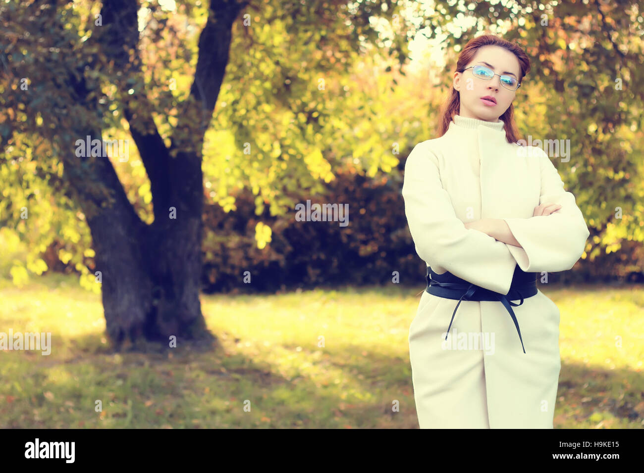 girl in a park walk autumn alone Stock Photo - Alamy