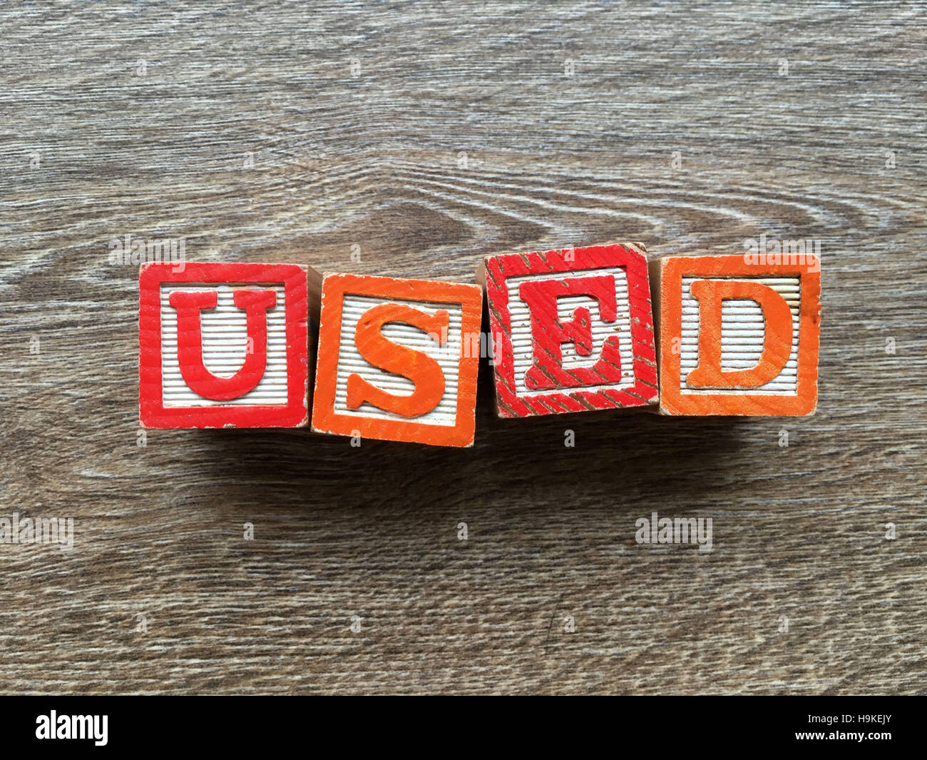 Alphabet wood blocks making the word USED Stock Photo - Alamy