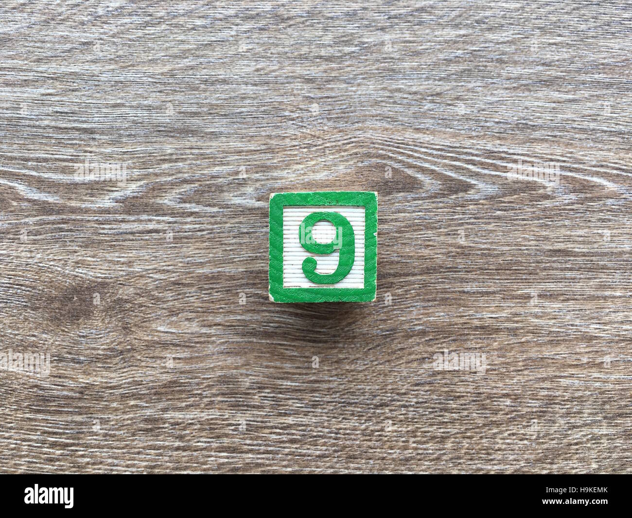 Wood Cube or Block with the number 9 Stock Photo - Alamy