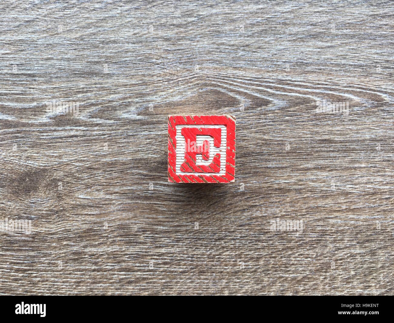 Wood Cube or Block withthe E letter Stock Photo - Alamy