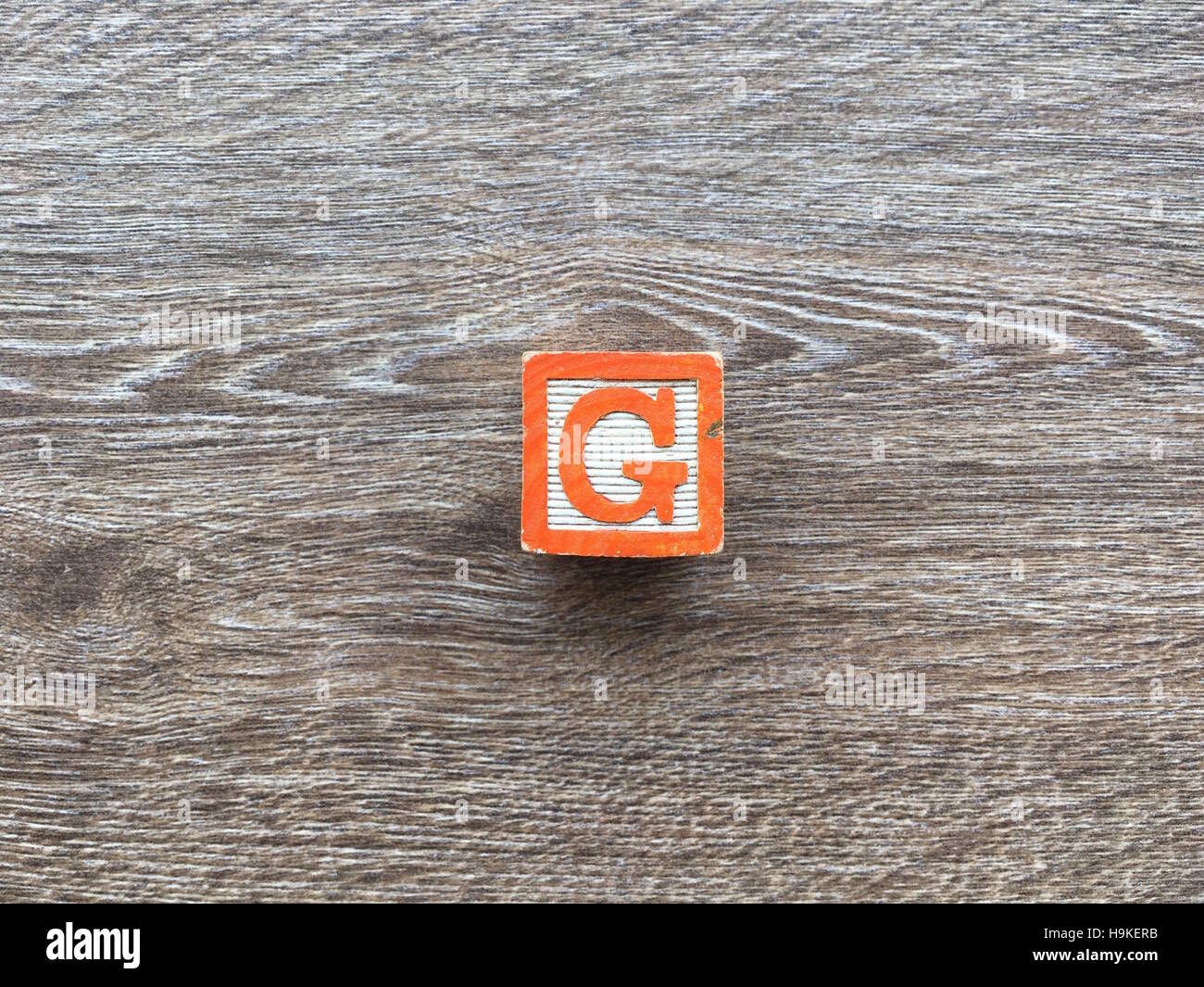 Wood Cube or Block with the G letter Stock Photo - Alamy