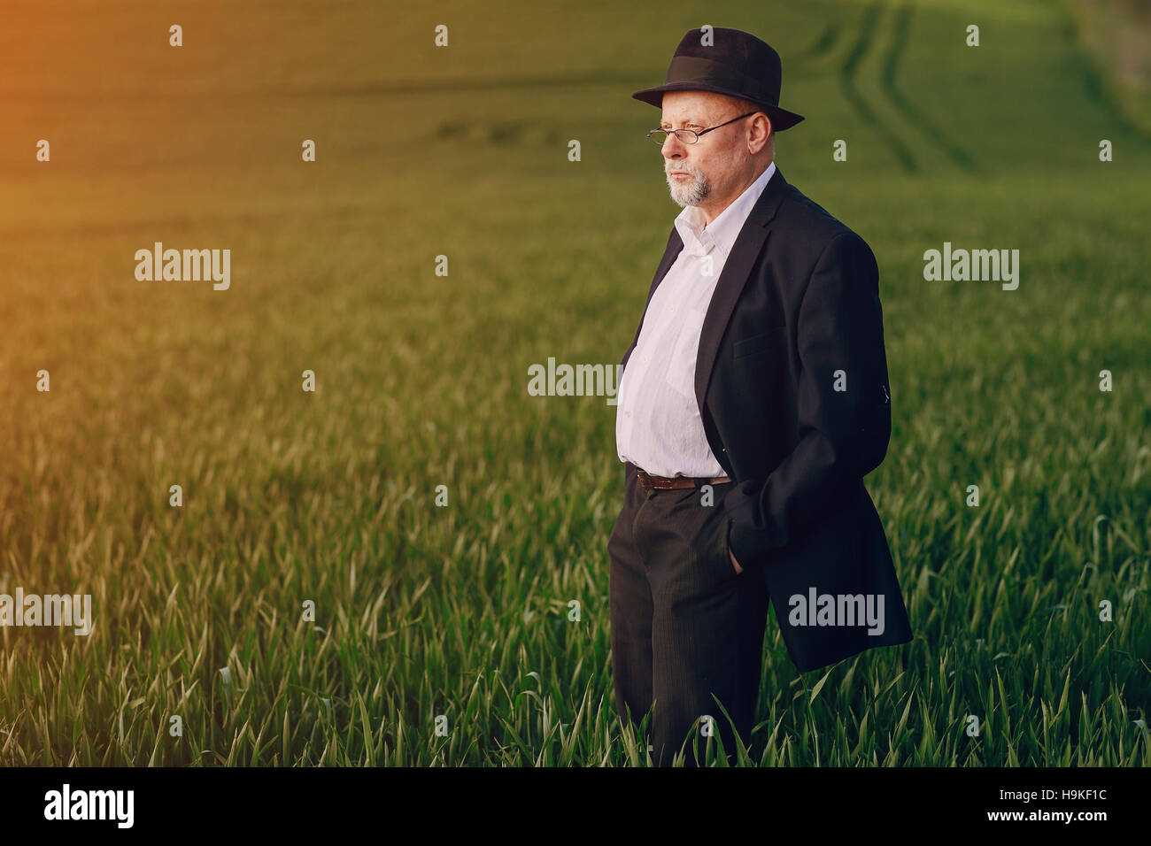 old man in field Stock Photo - Alamy