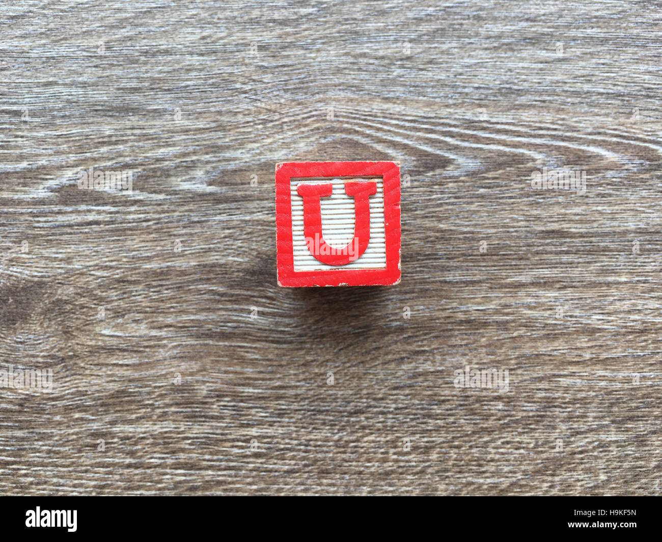 Wood Cube or Block making the U Letter Stock Photo - Alamy