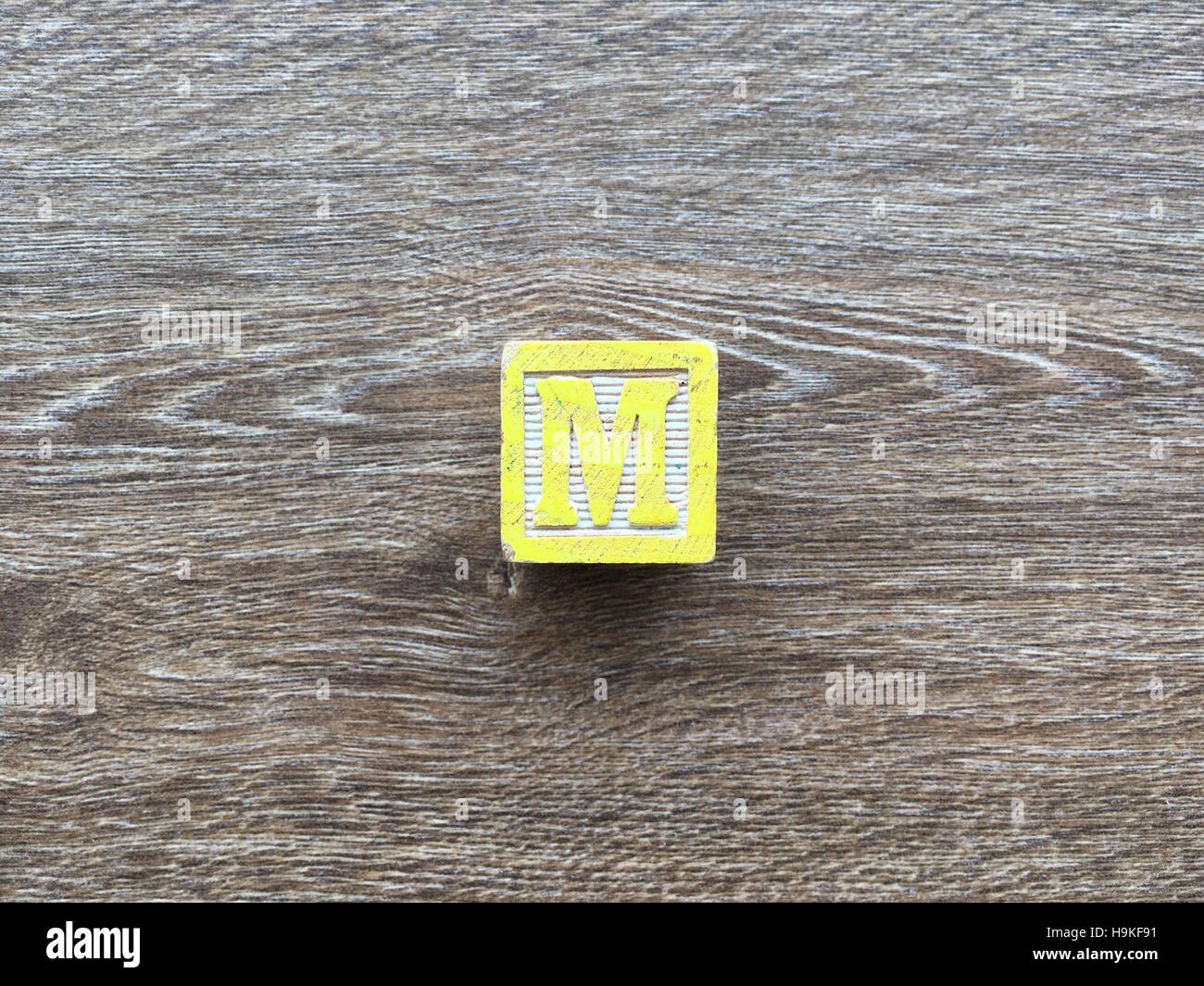 Wood Cube or Block making the letter M Stock Photo - Alamy