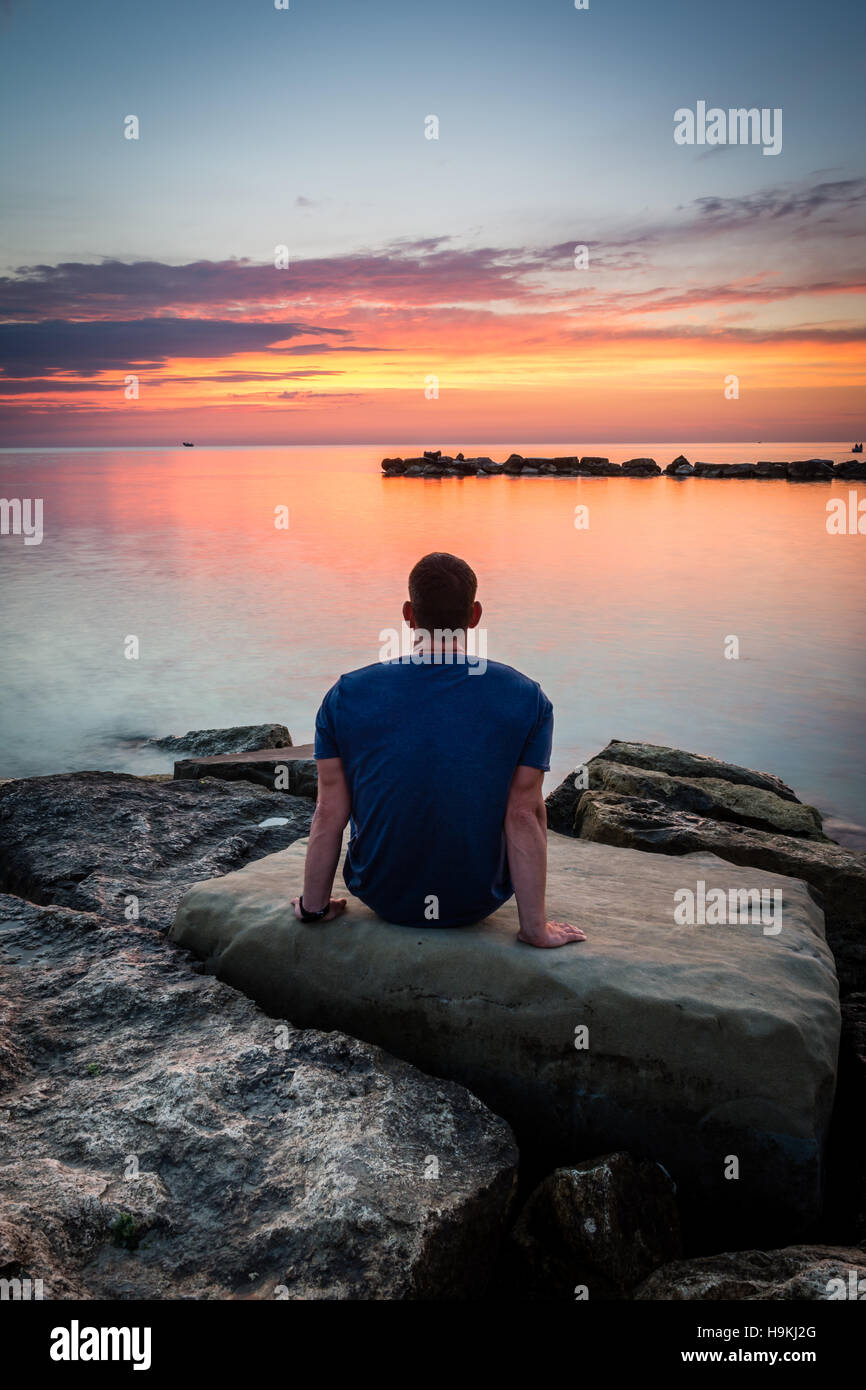 Man looking at sunrise hi-res stock photography and images - Alamy