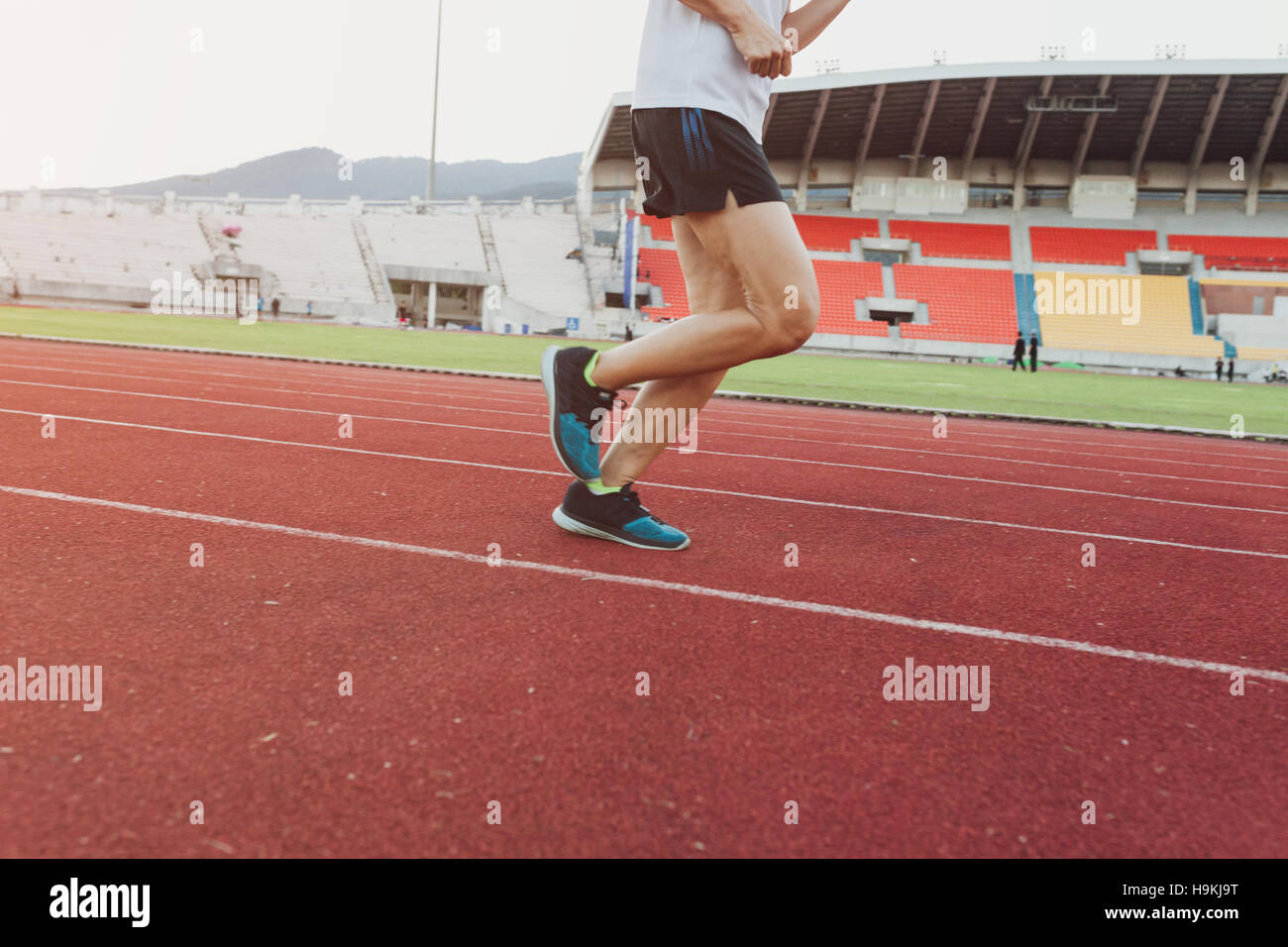 Runners sprinting outdoors Sportive people training in a urban area ...