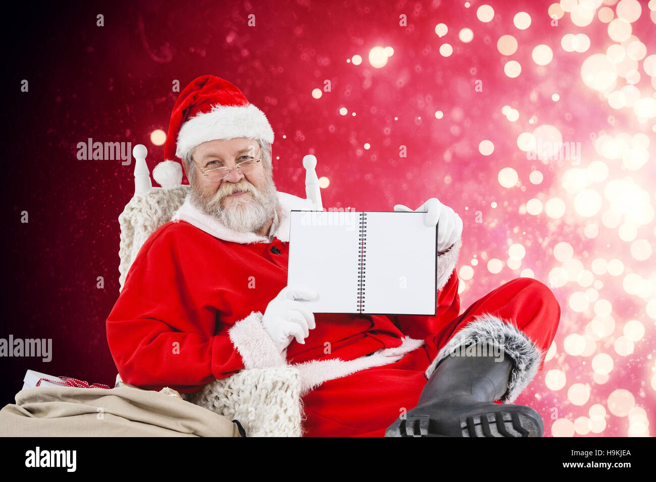 Composite image of santa claus showing diary Stock Photo - Alamy