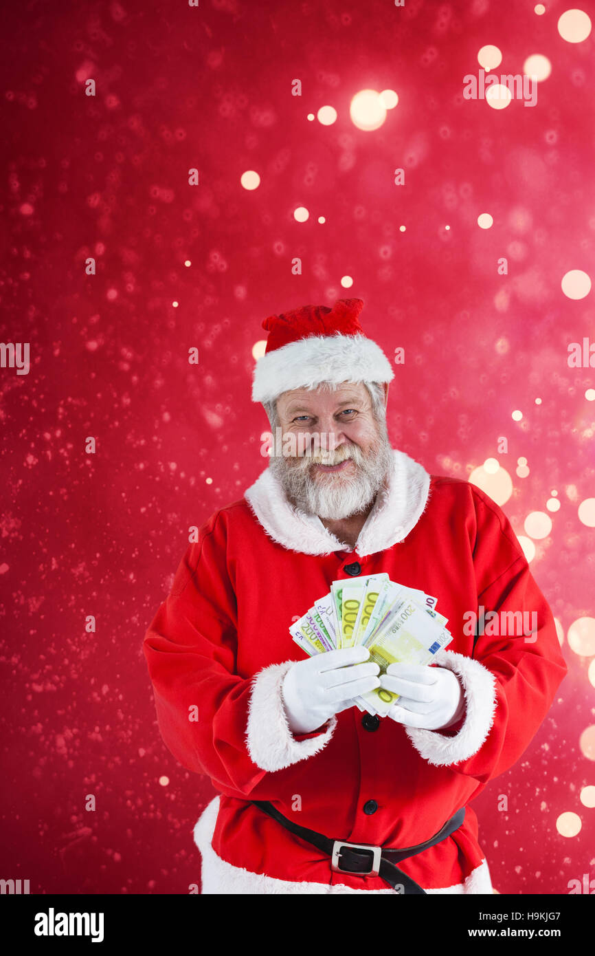Happy santa claus showing cash hi-res stock photography and images - Alamy