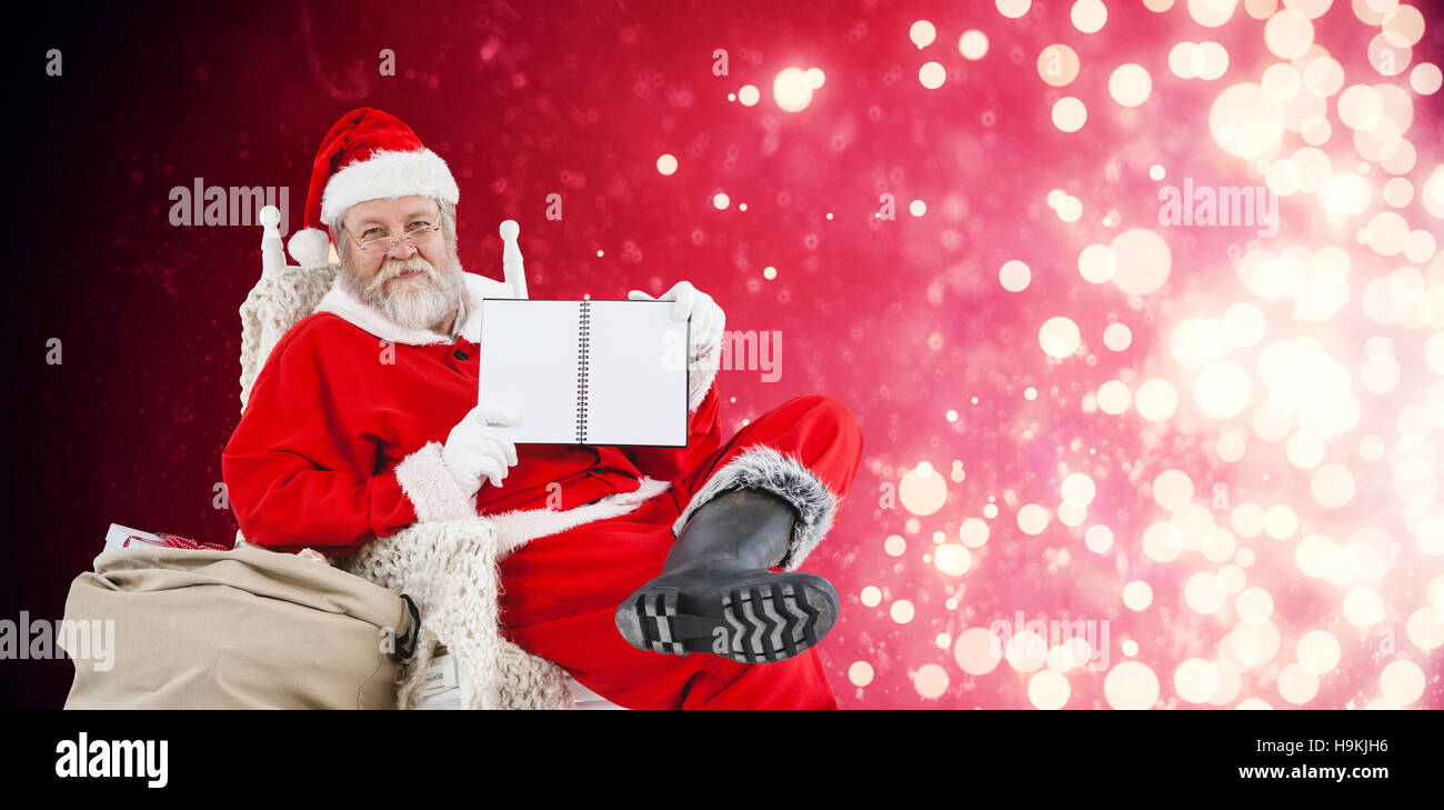 Composite image of santa claus showing diary Stock Photo - Alamy
