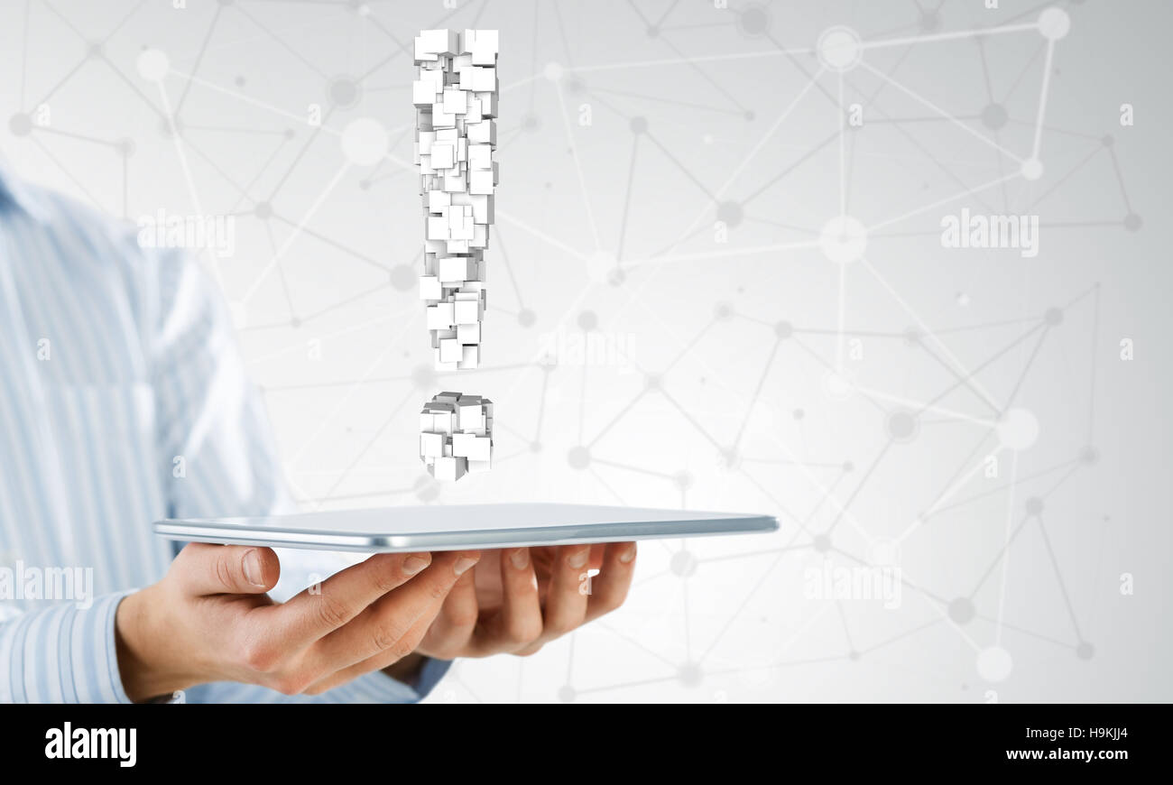 Exclamation mark and tablet Stock Photo - Alamy