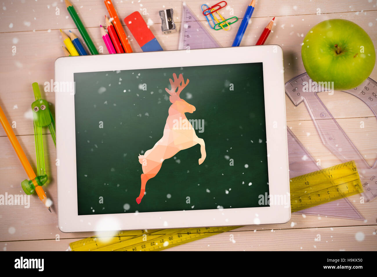 Composite image of graphic jumping reindeer Stock Photo - Alamy