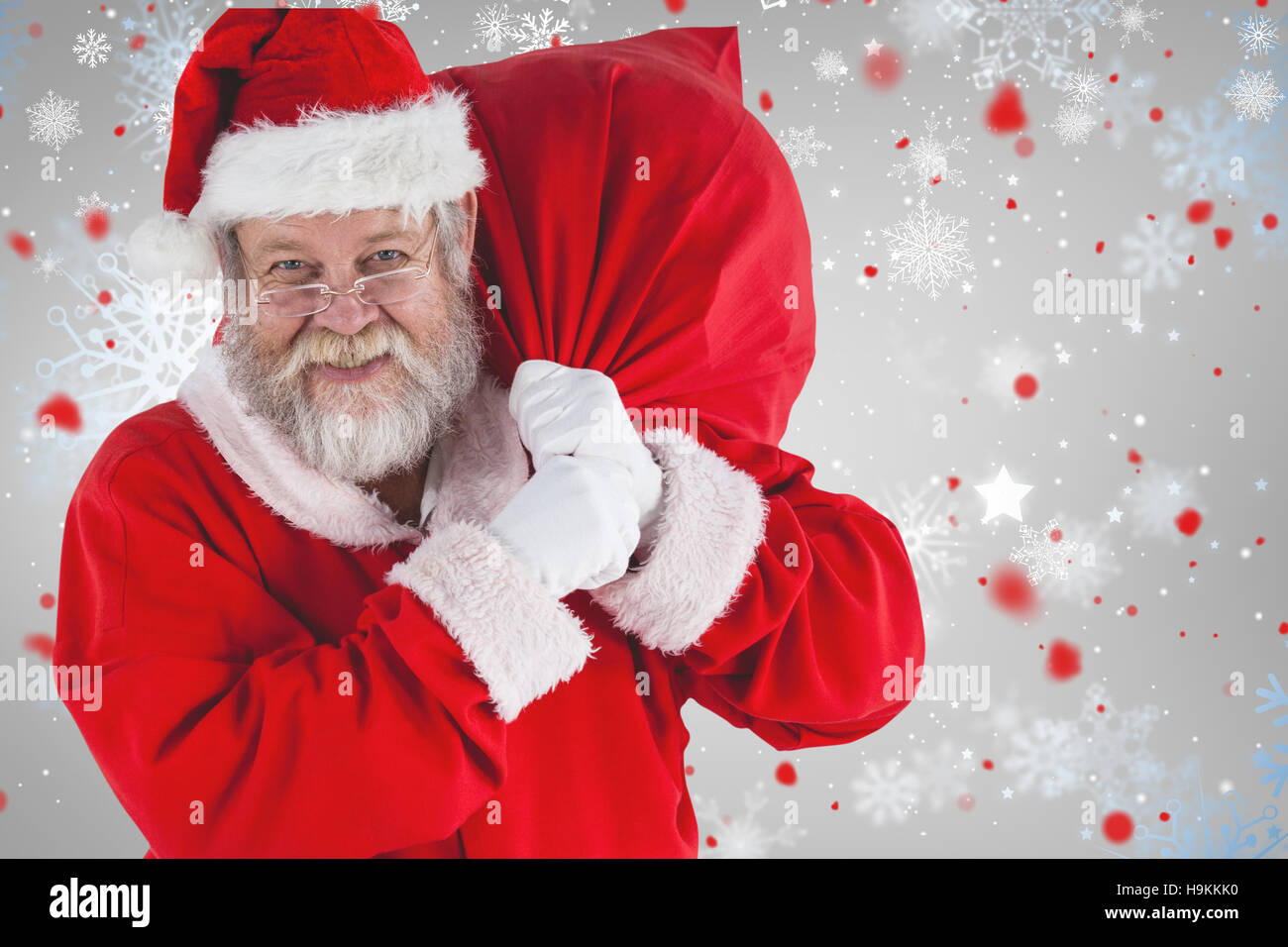 Composite image of portrait of santa claus holding christmas sack Stock ...