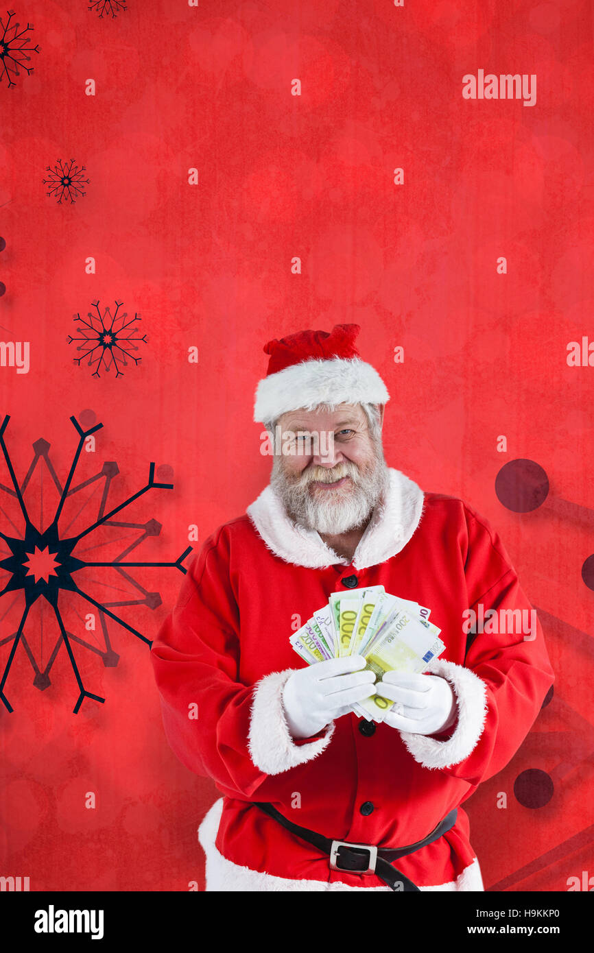 Composite image of santa claus showing currency notes Stock Photo - Alamy