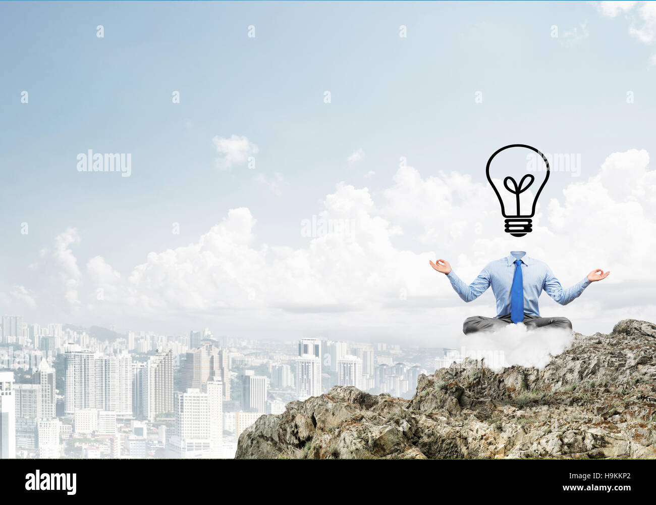 Headless businessman meditating Stock Photo - Alamy