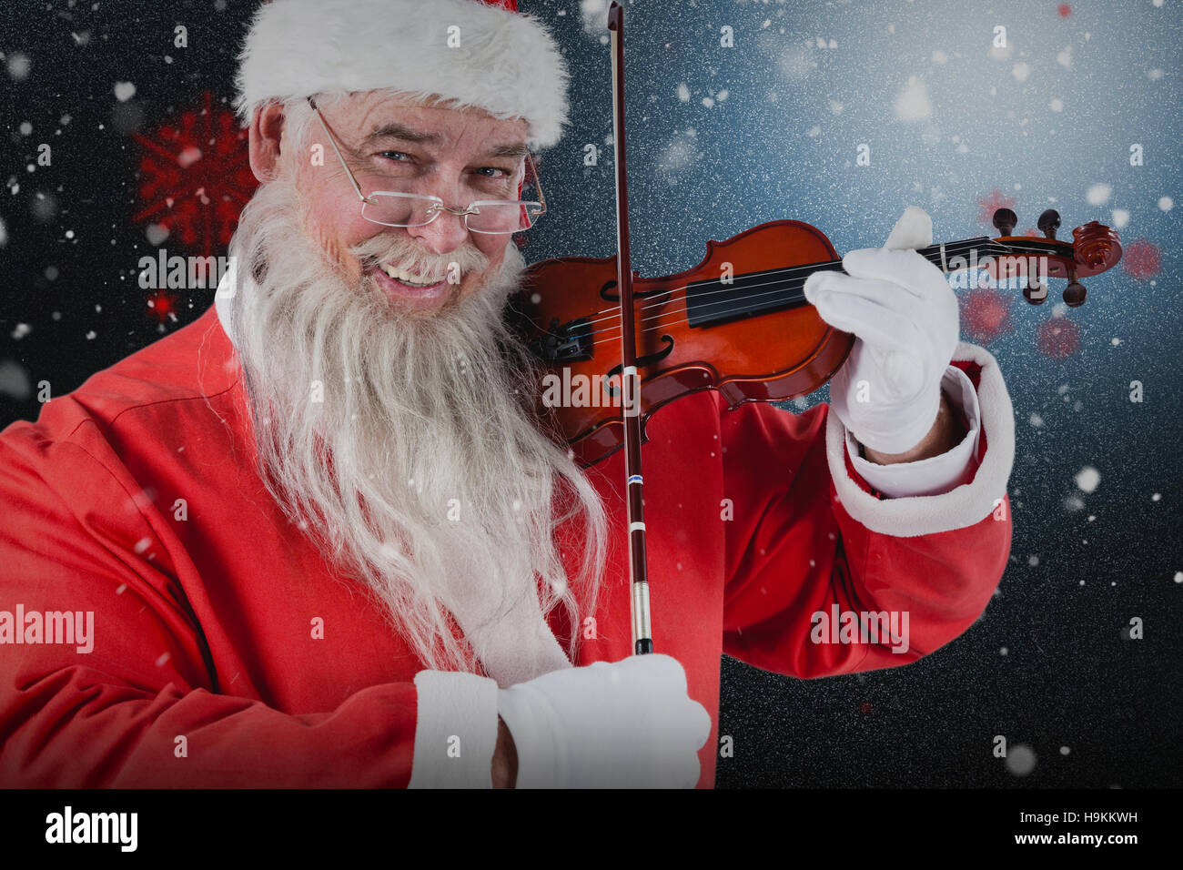 Composite image of portrait of santa claus playing violin Stock Photo ...