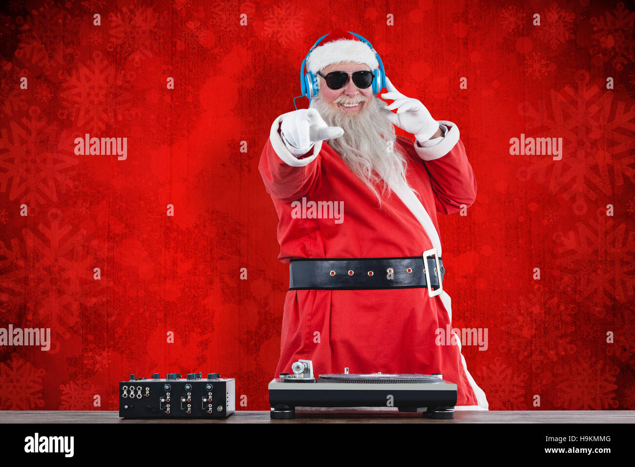 Composite image of santa claus mixing sound Stock Photo - Alamy