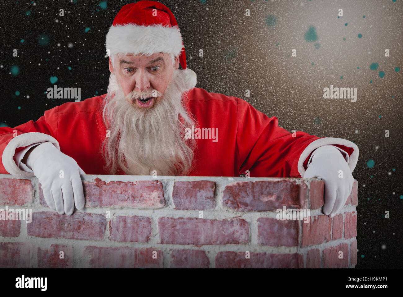 Composite image of santa claus peeking over wall Stock Photo - Alamy