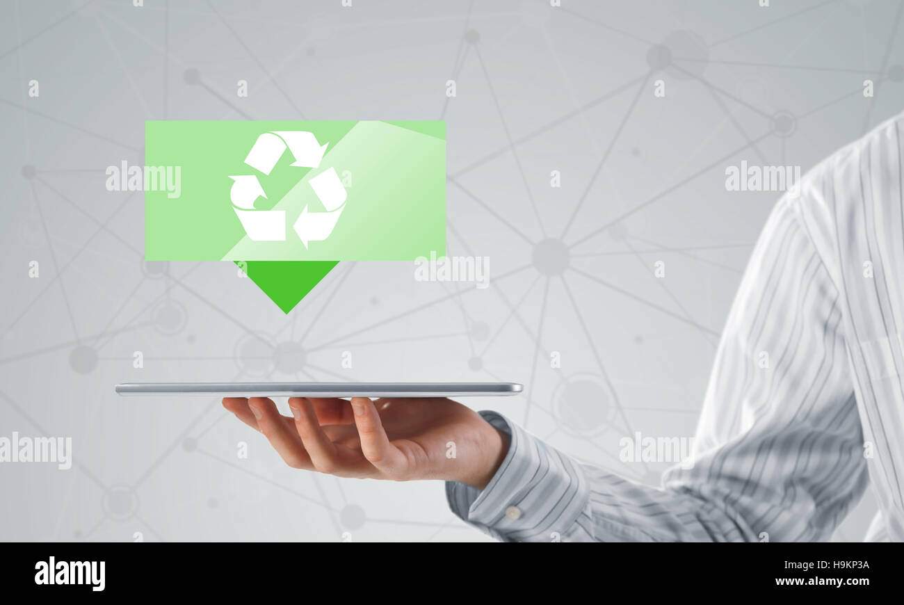 Businessman hand touch screen recycle sign icons on a tablet Stock ...