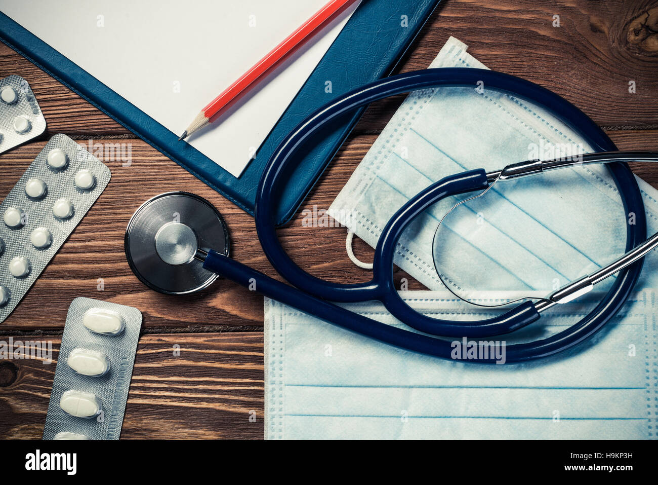 Desk of doctor with medicine things Stock Photo - Alamy