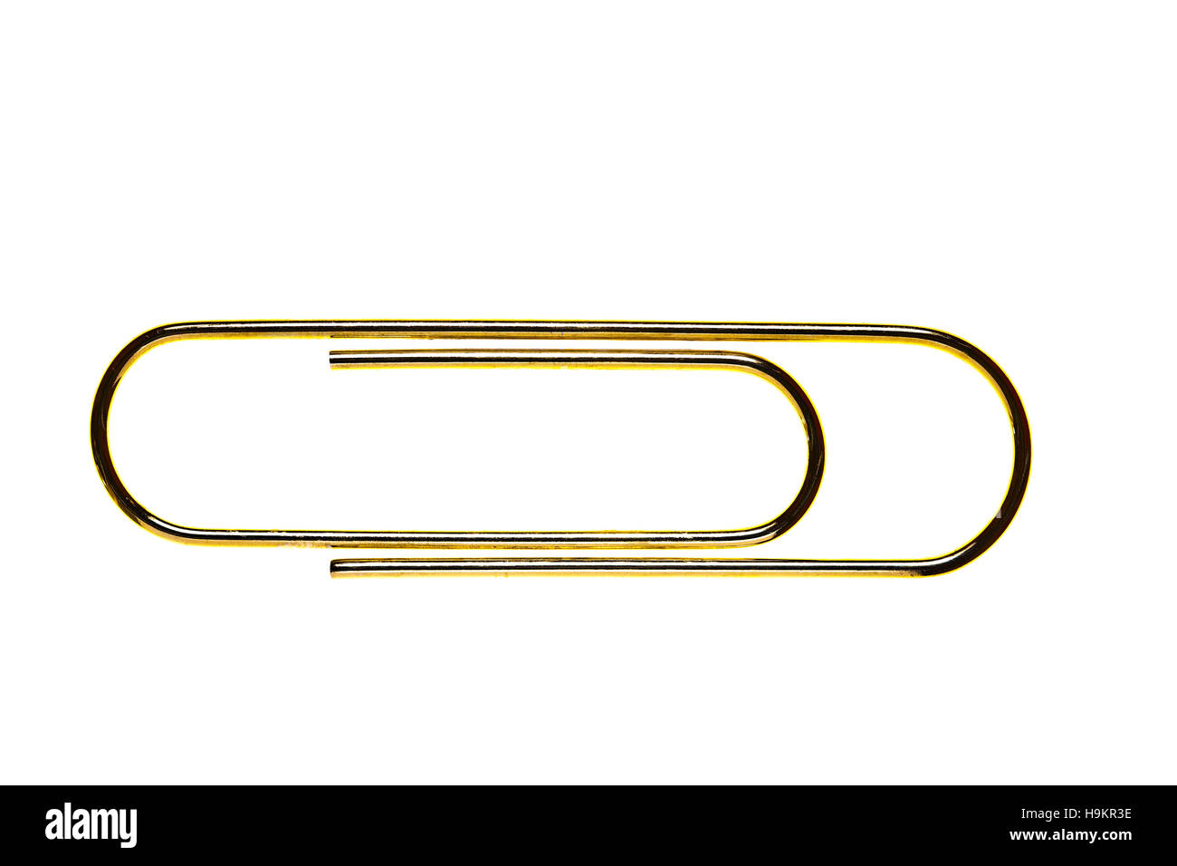 giant gold colored giant paper clip Stock Photo - Alamy