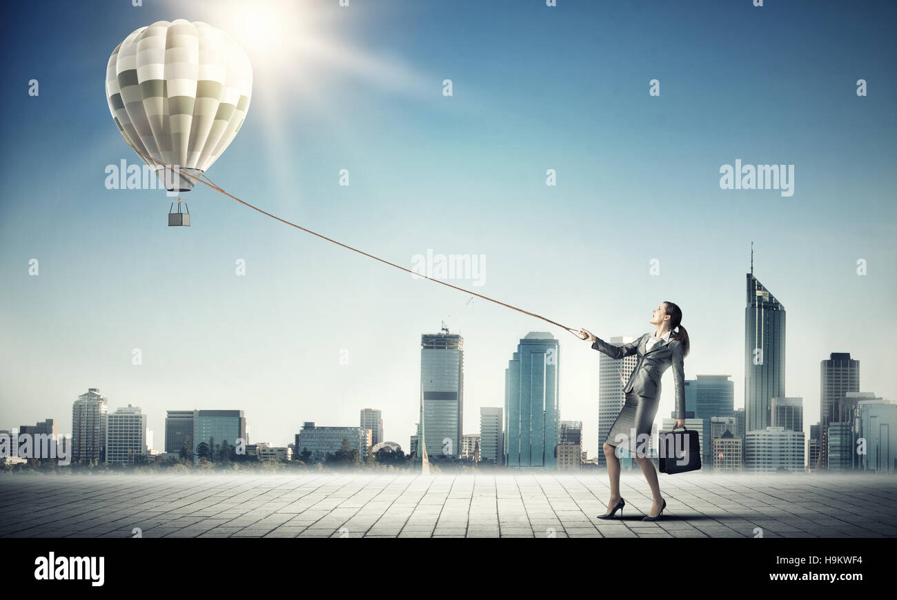 Woman catch balloon Stock Photo - Alamy