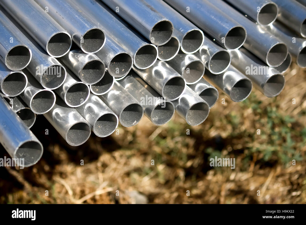 Stack of Many Pipes at the Construction Site Stock Photo - Alamy