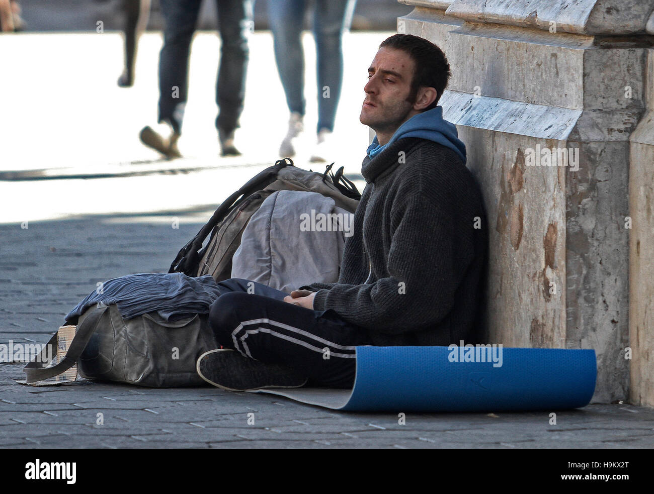 Homeless asks for money in a commercial street in Barcelona Stock Photo ...