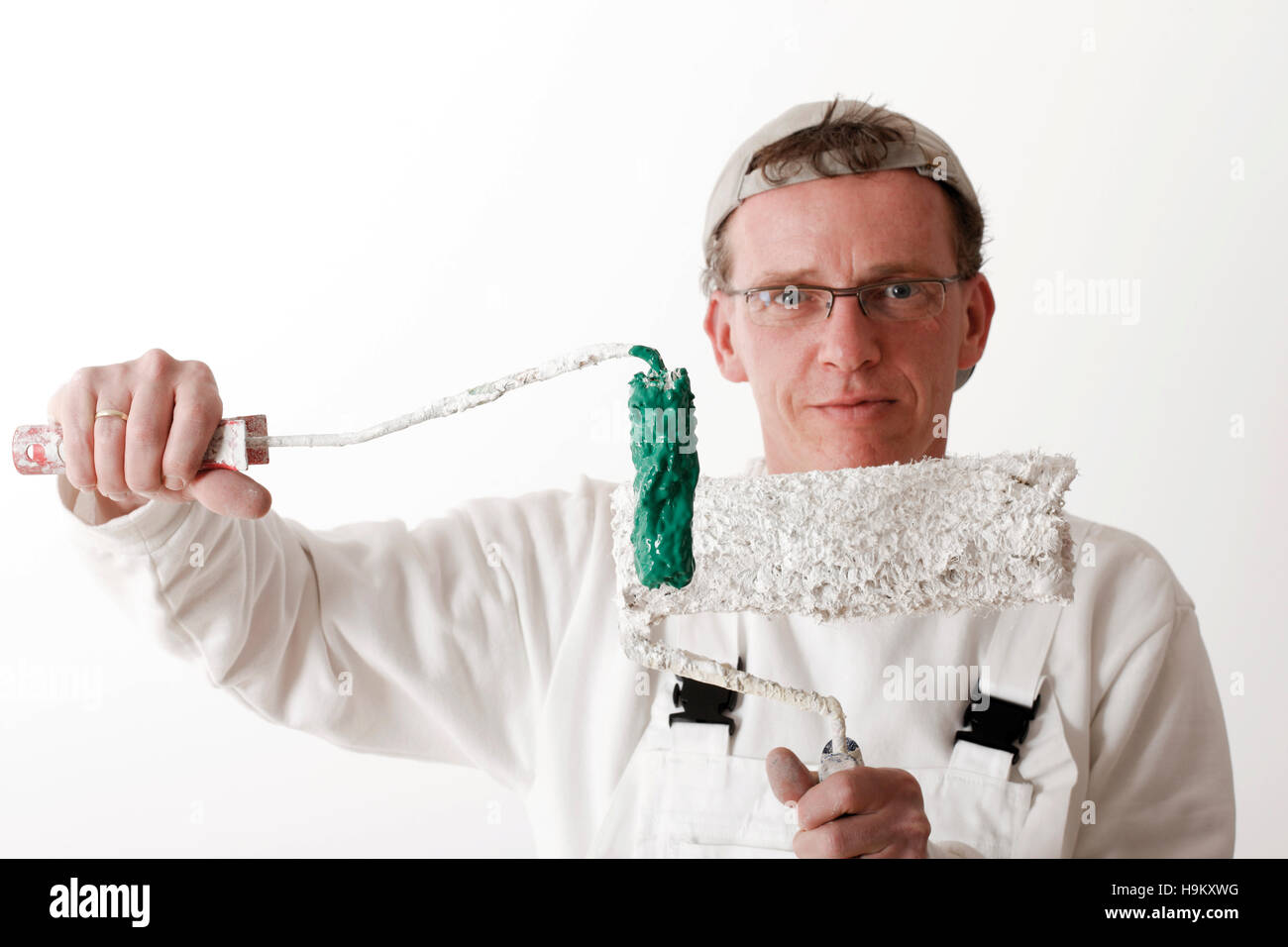 Painter with paint rollers Stock Photo - Alamy