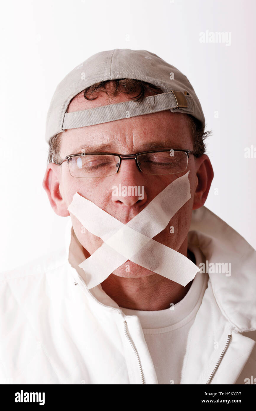 Workman, mouth covered with duct tape Stock Photo - Alamy