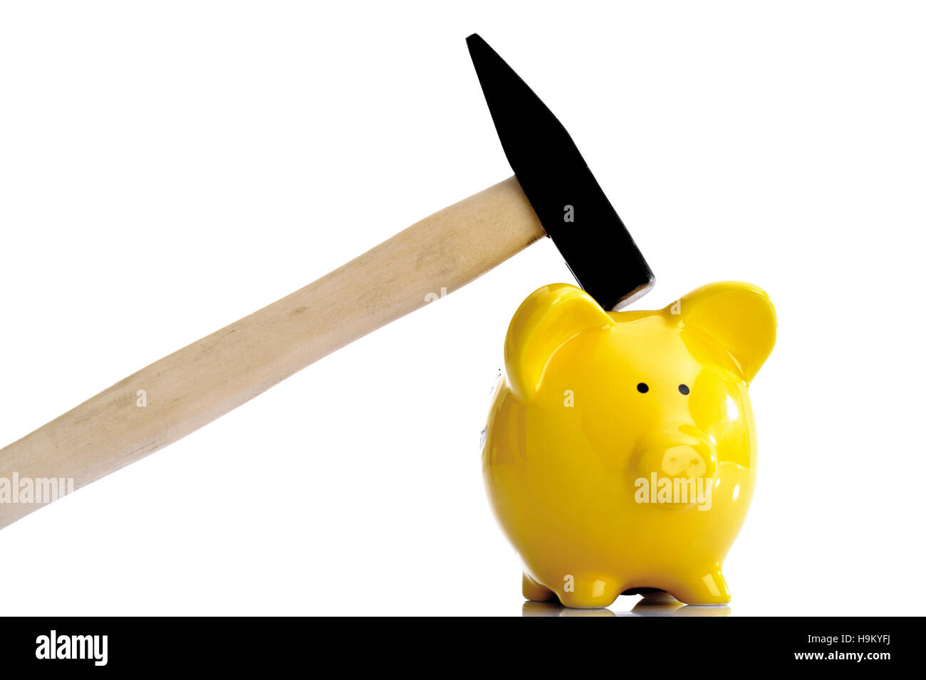 Hammer and a yellow piggy bank Stock Photo - Alamy