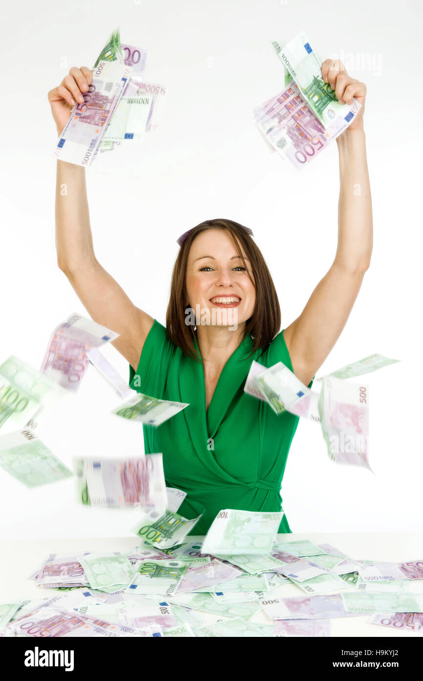 Young woman throwing money around Stock Photo - Alamy
